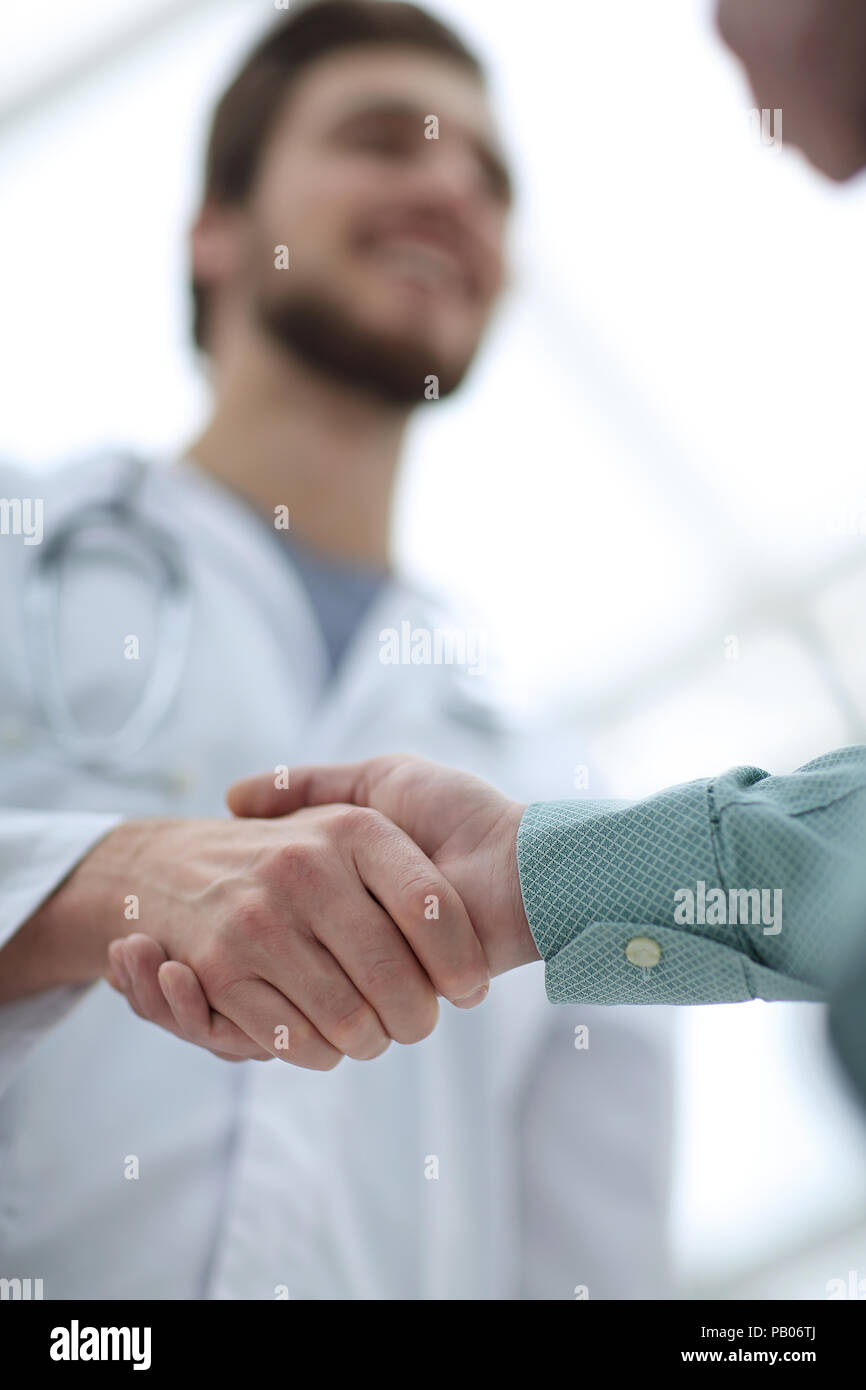 closeup.handshake between doctor and patient Stock Photo - Alamy