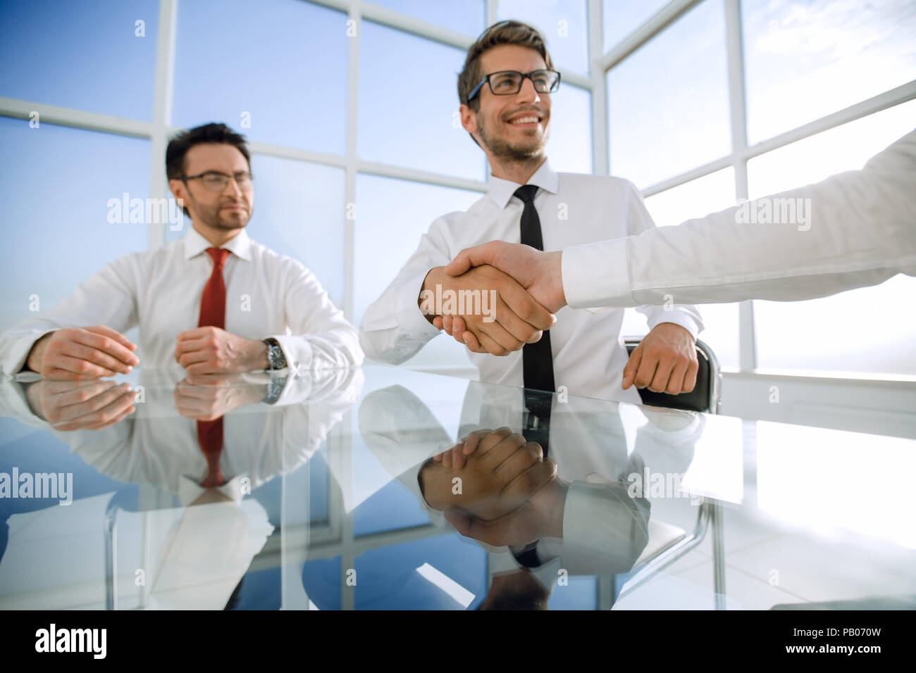 Three professional partners sitting table hi-res stock photography and images - Alamy