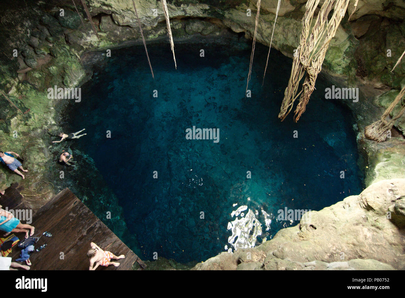 Cuzama, Yucatan, Mexico - 2018: People swim in an underground river ...