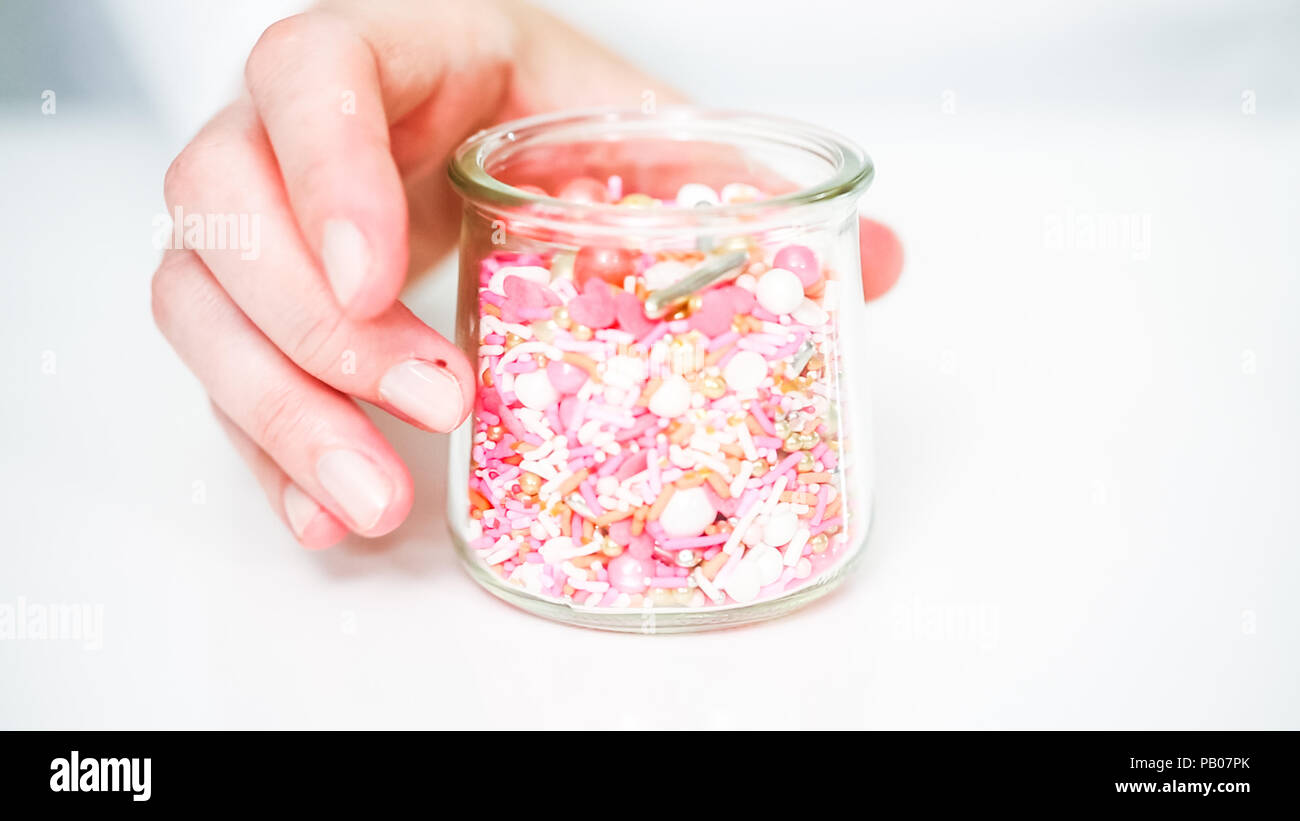 Colorful pink sprinkle blend on a white background Stock Photo - Alamy