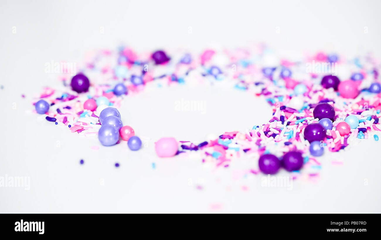 Colorful purple sprinkle blend on a white background Stock Photo - Alamy