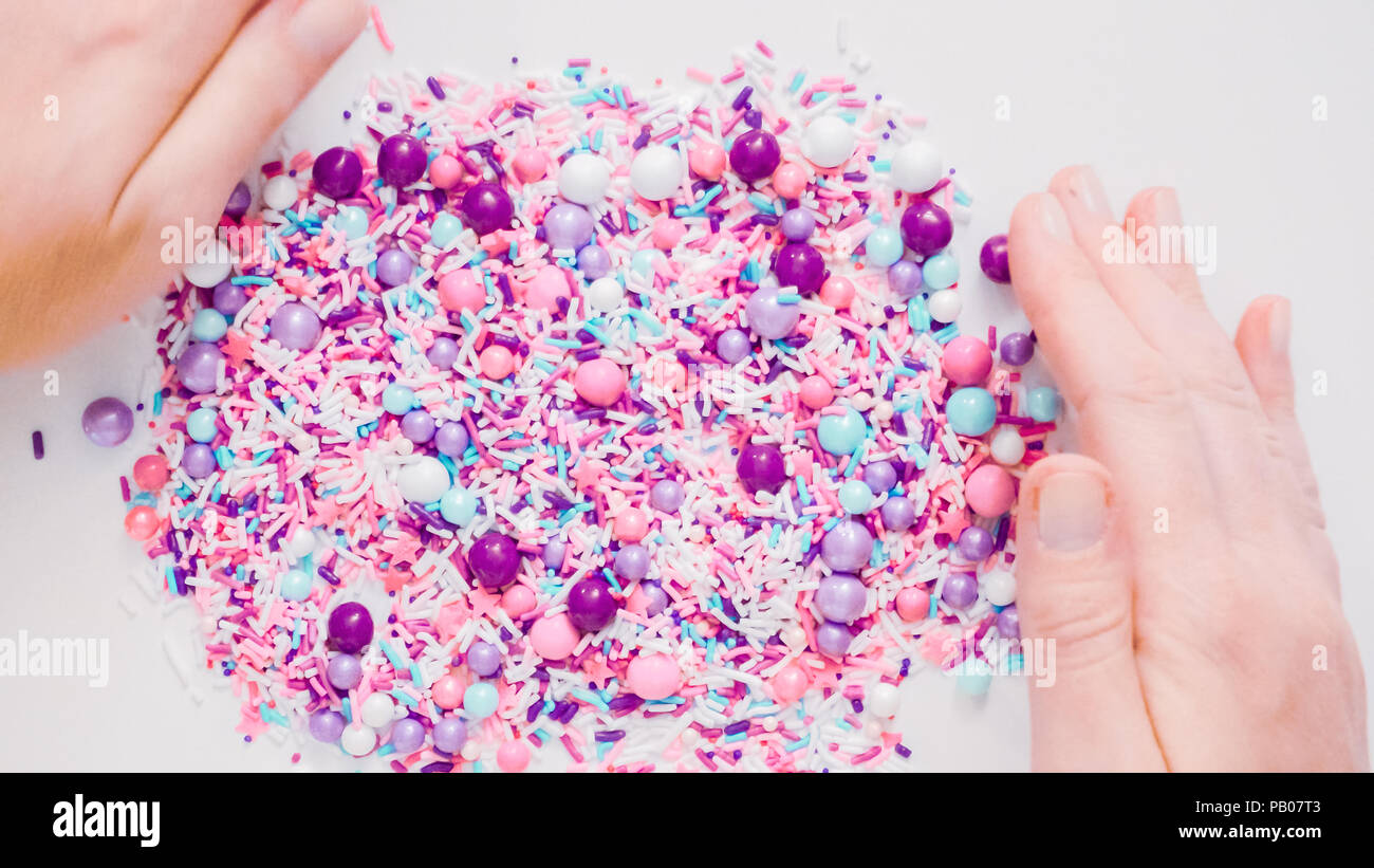 Colorful purple sprinkle blend on a white background Stock Photo - Alamy