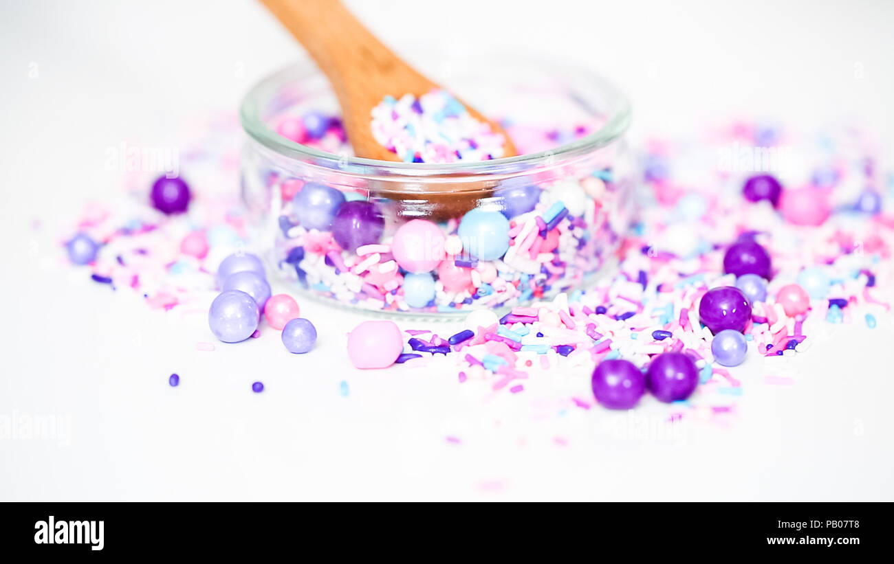 Colorful purple sprinkle blend on a white background Stock Photo - Alamy