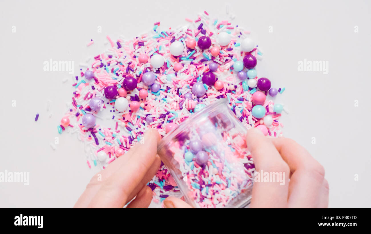 Colorful purple sprinkle blend on a white background Stock Photo - Alamy