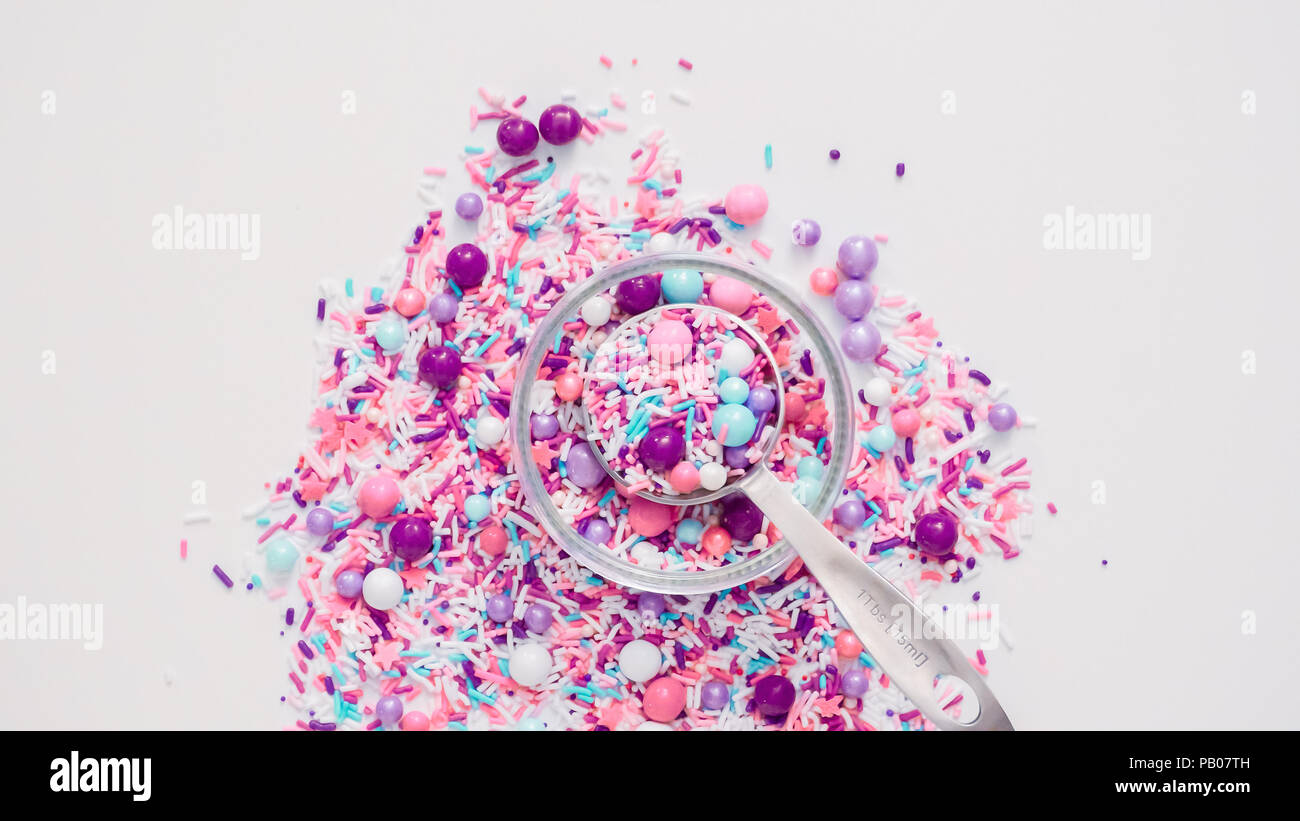 Colorful purple sprinkle blend on a white background Stock Photo - Alamy