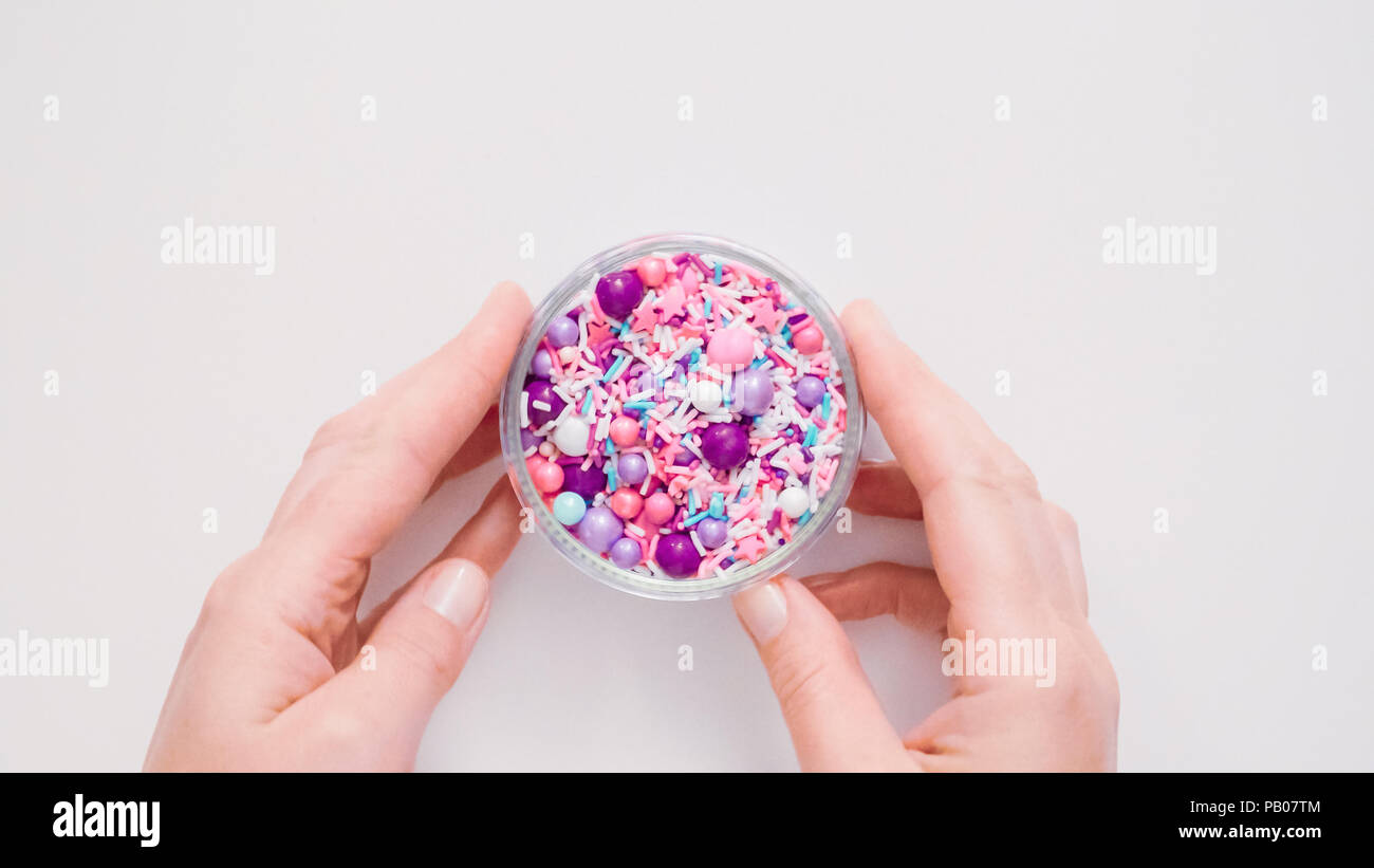 Colorful purple sprinkle blend on a white background Stock Photo - Alamy