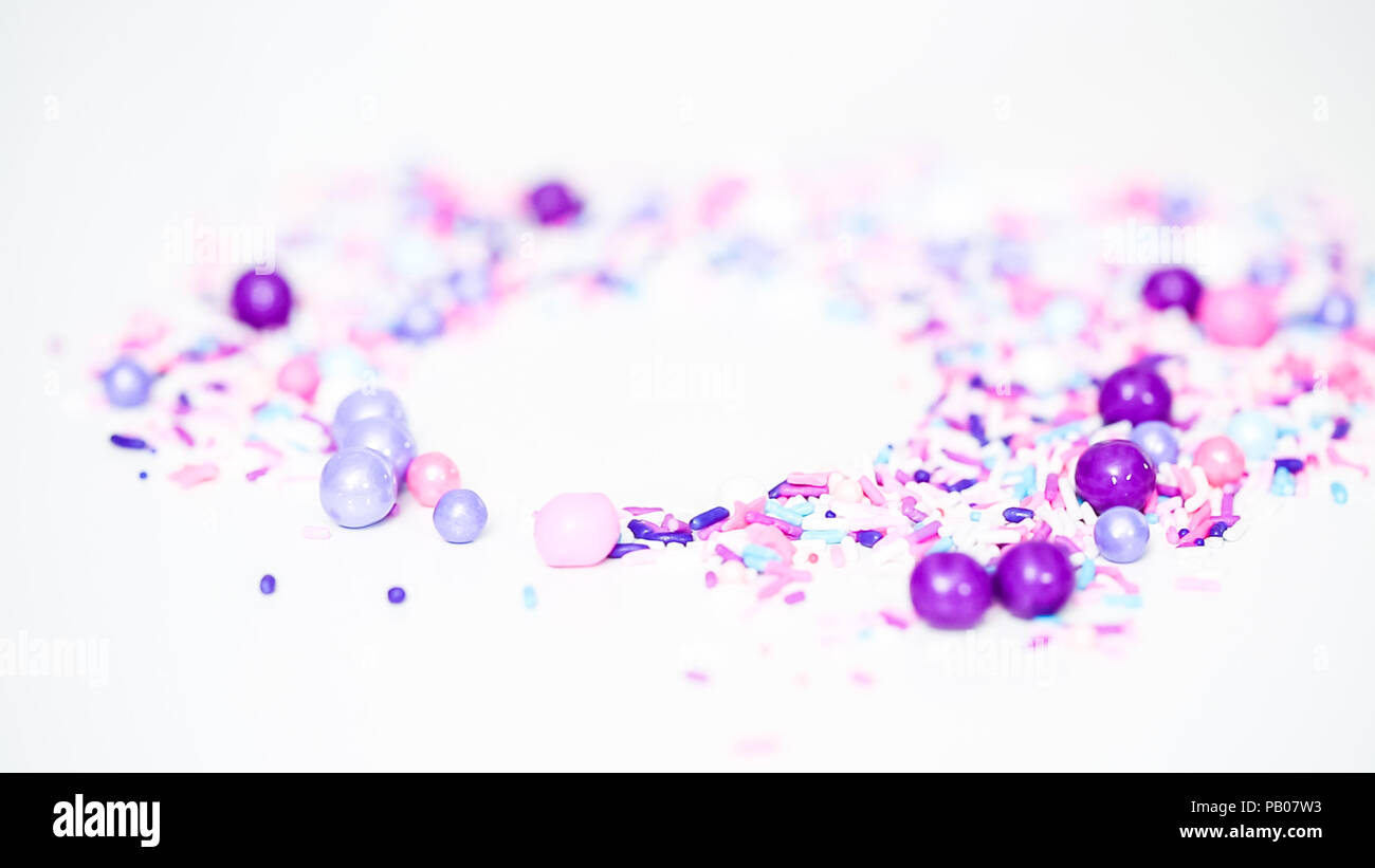 Colorful purple sprinkle blend on a white background Stock Photo - Alamy