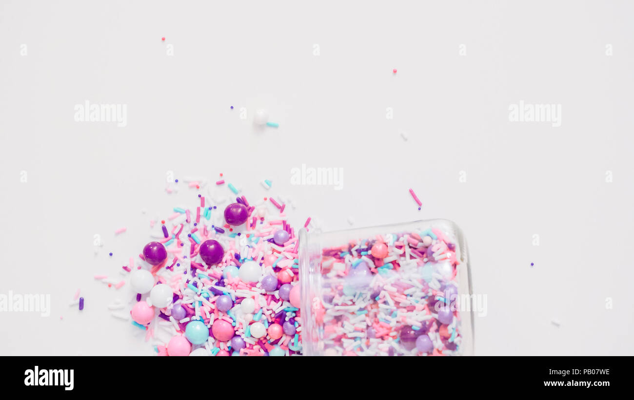 Colorful purple sprinkle blend on a white background Stock Photo - Alamy