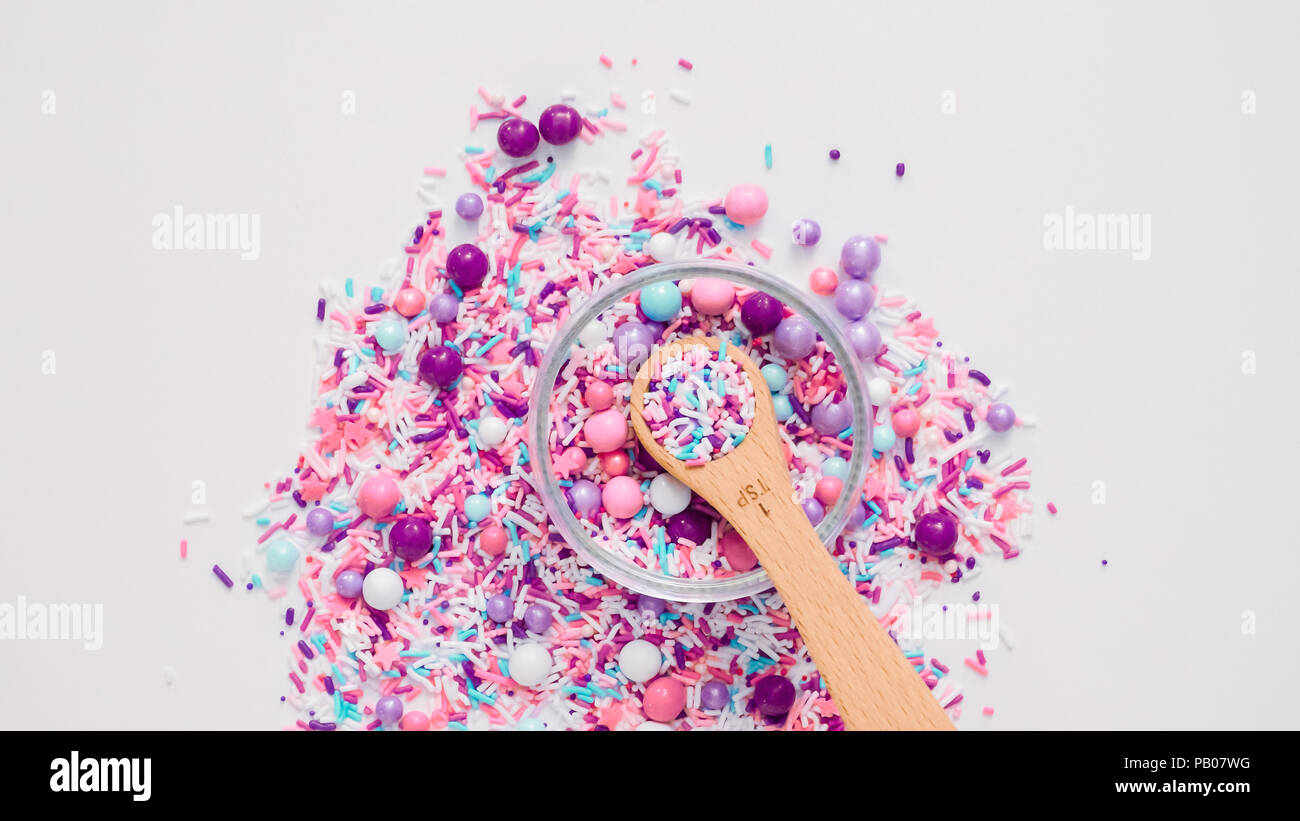 Colorful purple sprinkle blend on a white background Stock Photo - Alamy