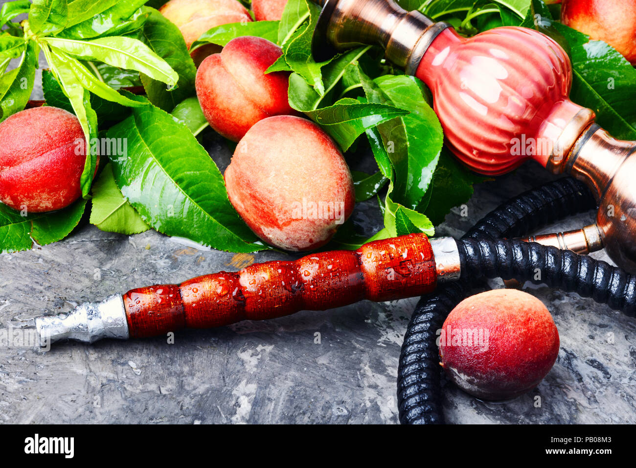 Hookah for smoking with the aroma peach.Peach shisha Stock Photo - Alamy