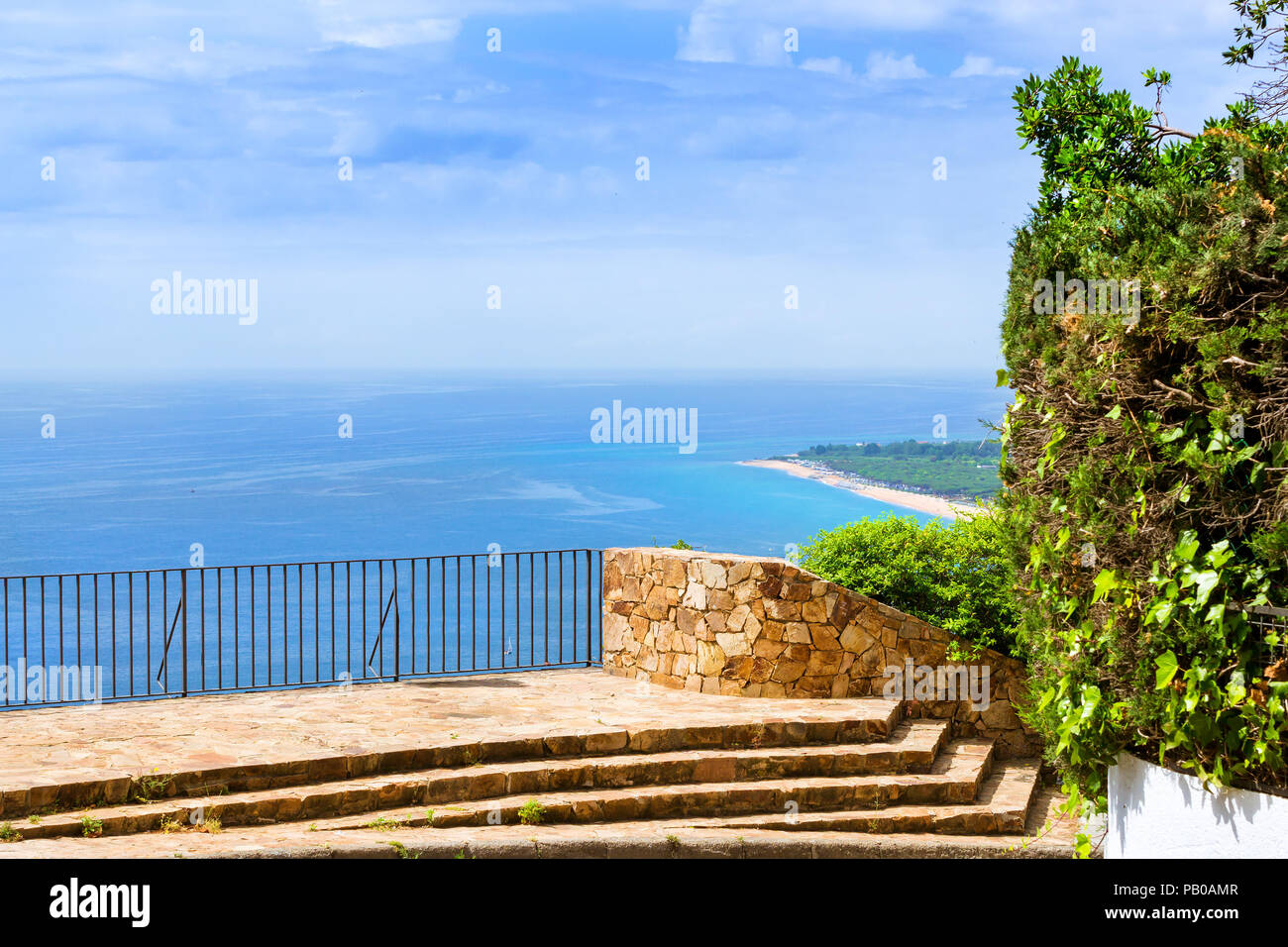 Panorama of sunny beach coast from height of stone observation deck ...