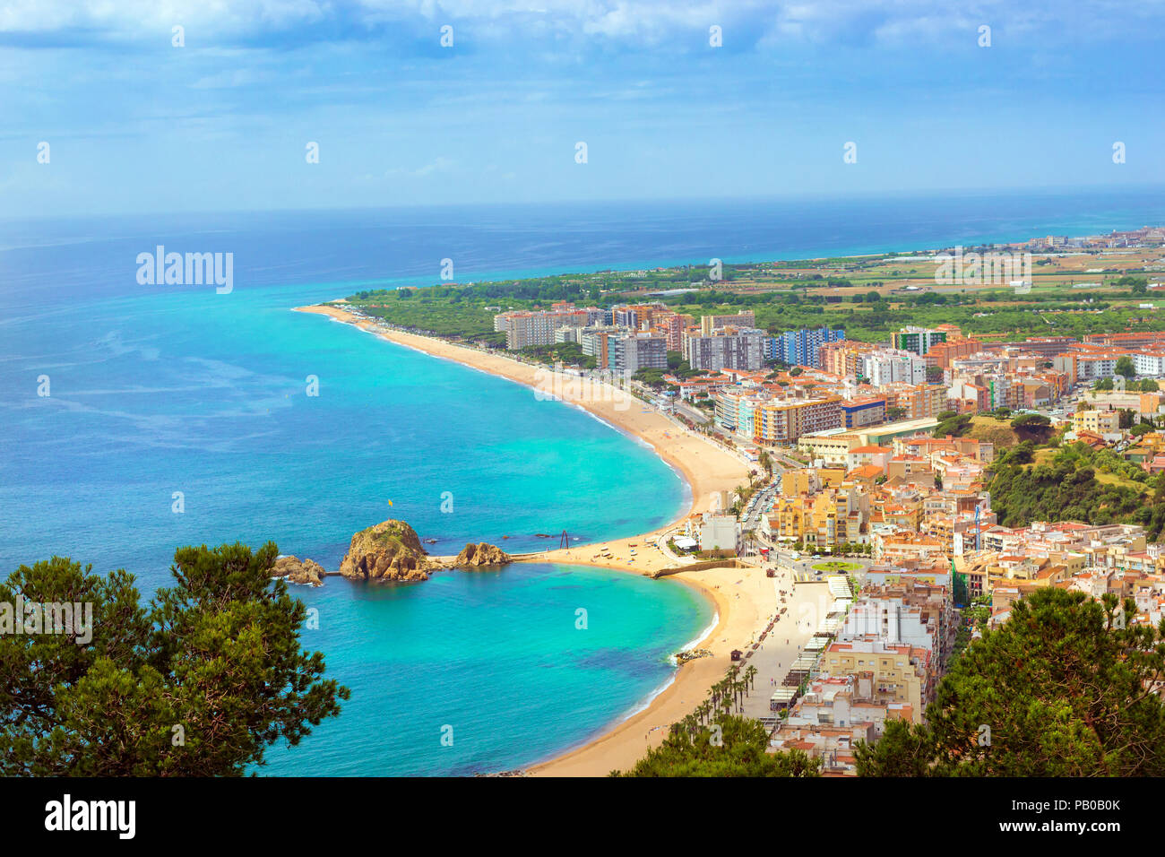 Rock Sa Palomera on coast of Spanish beach resort Blanes in summertime ...