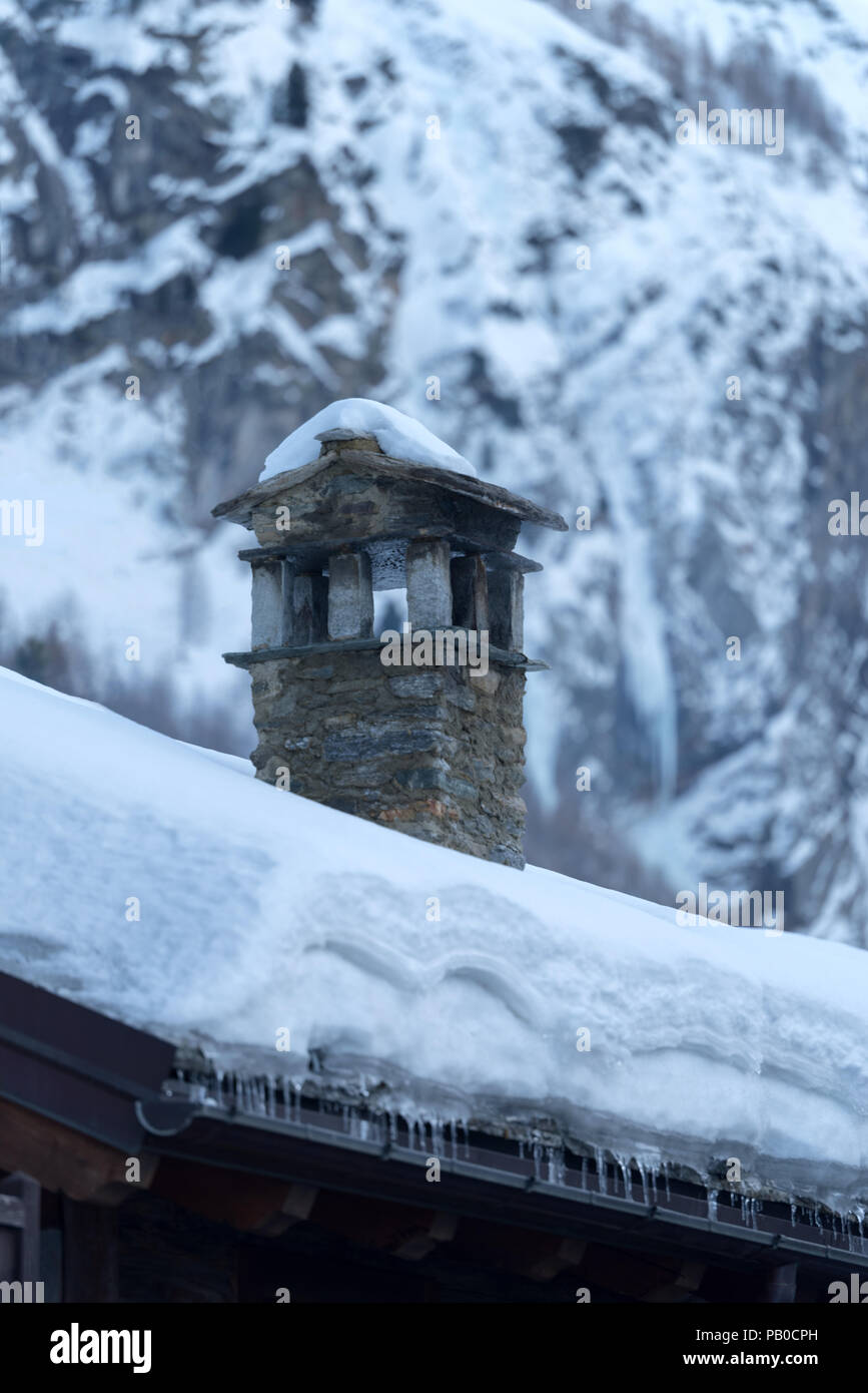 Cottage chimney on the roof covered with snow Stock Photo - Alamy