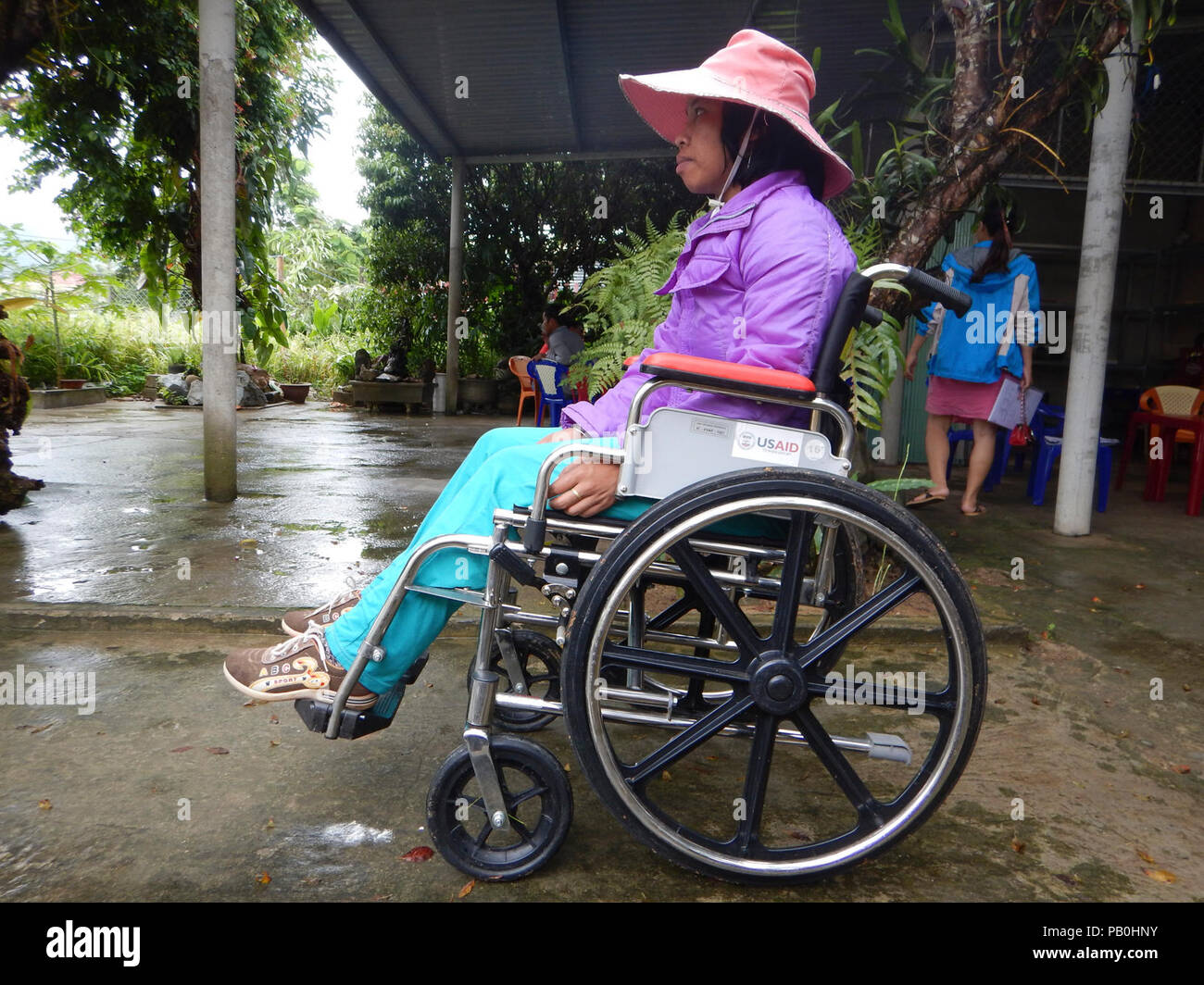 A women sitting on a wheelchair provided by the project Stock Photo - Alamy