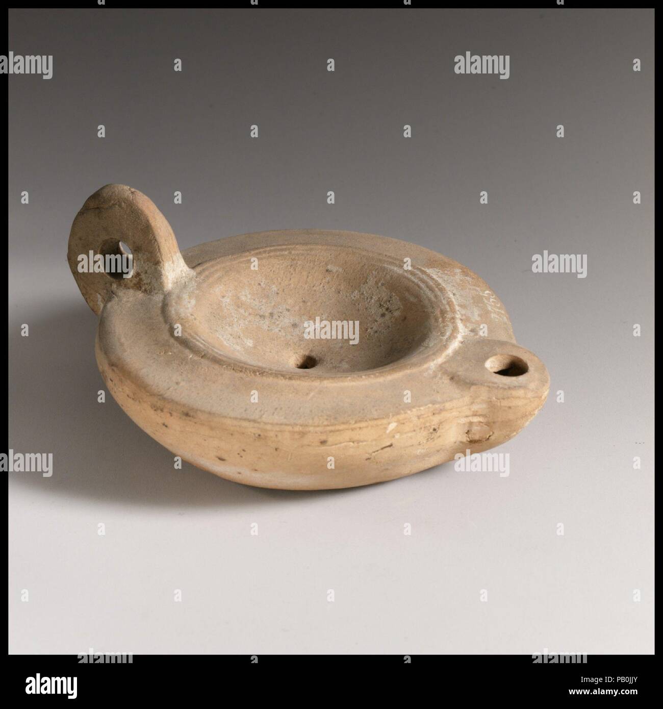 Lamp. Culture: Roman. Dimensions: Length: 4 1/16 in. (10.3 cm) Height ...