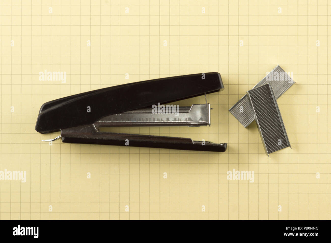 black stapler with paper clips shot close-up Stock Photo - Alamy