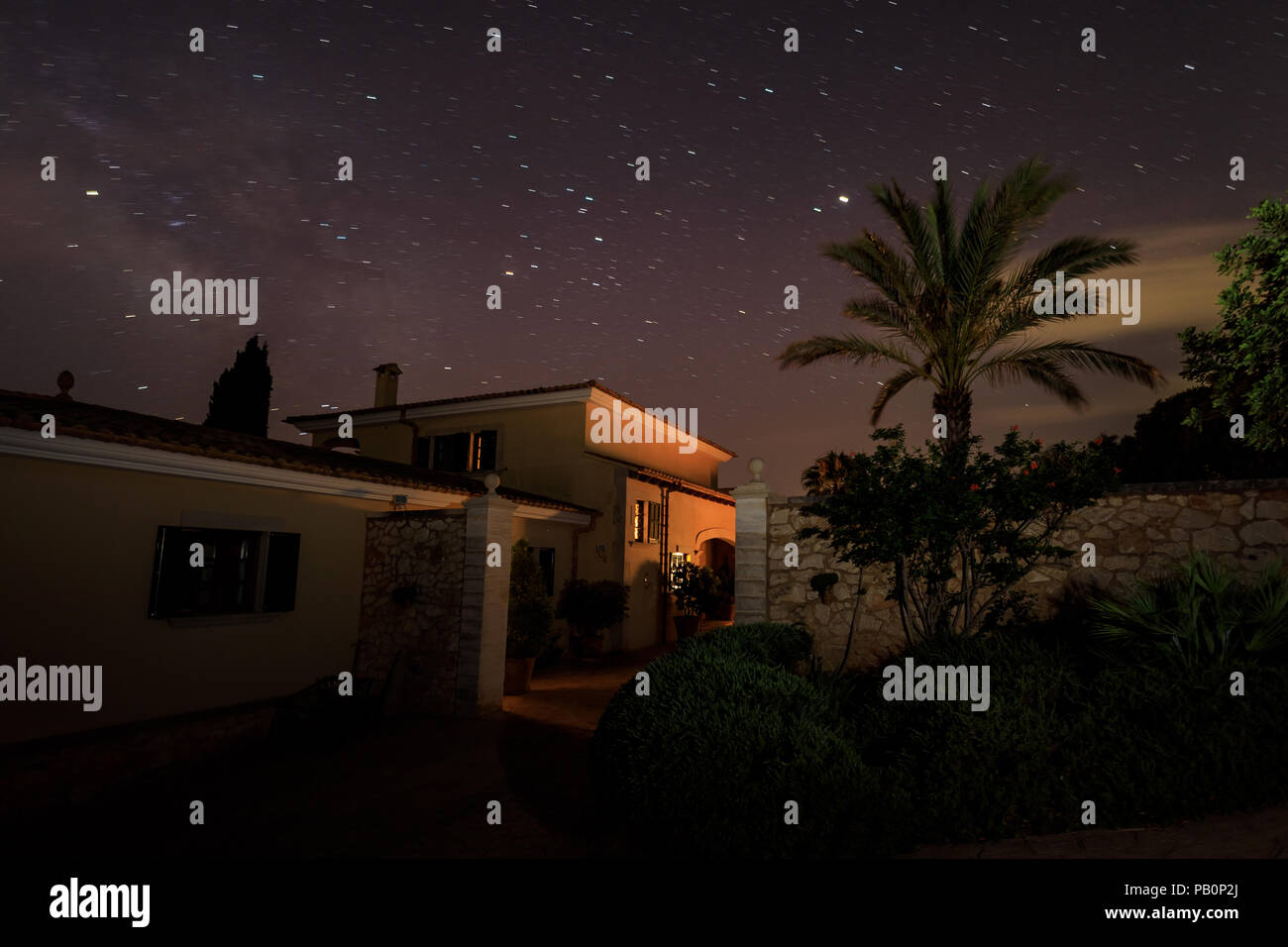 The spanish house under starry night sky Stock Photo - Alamy