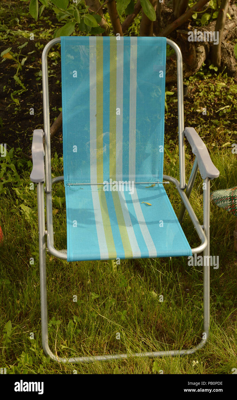 camping chair is set in the garden on the grass Stock Photo - Alamy