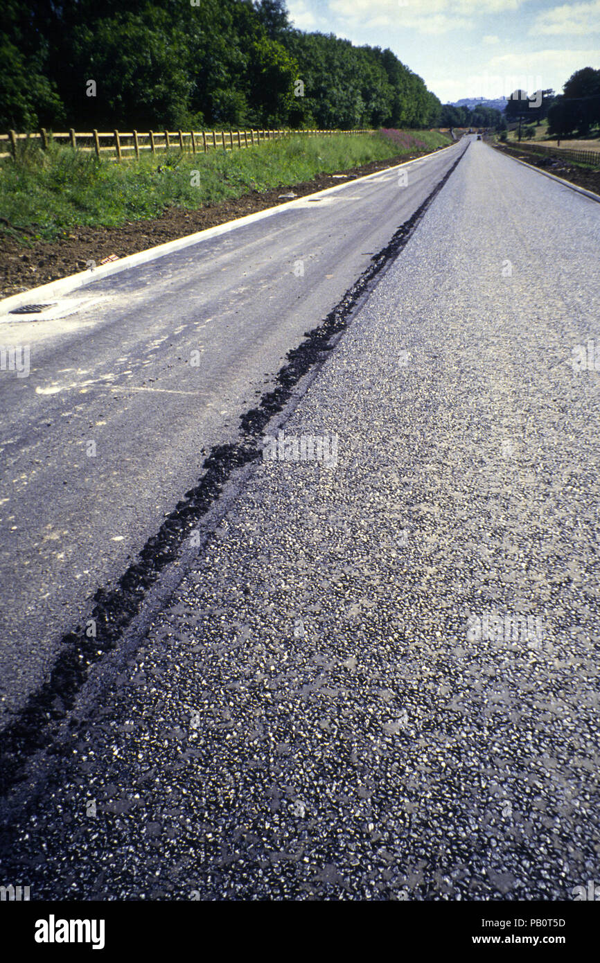 July 1994: A new road under construction being surfaced with tarmac ...
