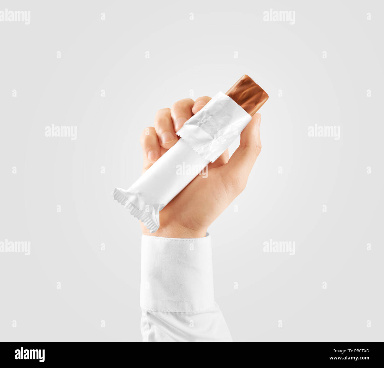 Blank white candy bar plastic wrap opened mockup hold in hand, clipping ...