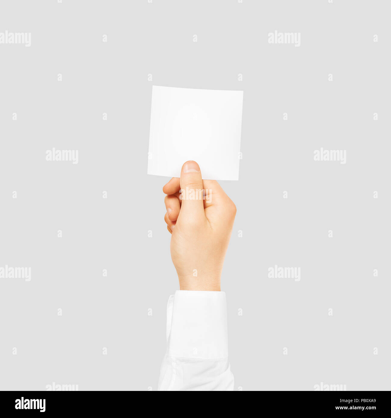 Hand holding square blank white sticker mock up isolated on gray ... Hand holding square blank white sticker mock up isolated on gray ...