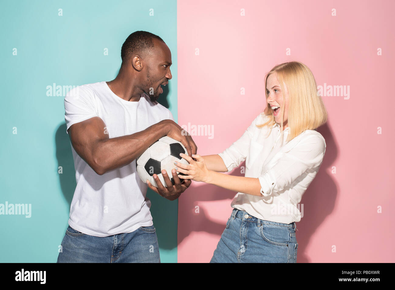 The unhappy and angry fans on colored blue and pink background Stock ...