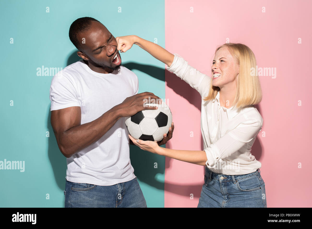 The unhappy and angry fans on colored blue and pink background Stock ...