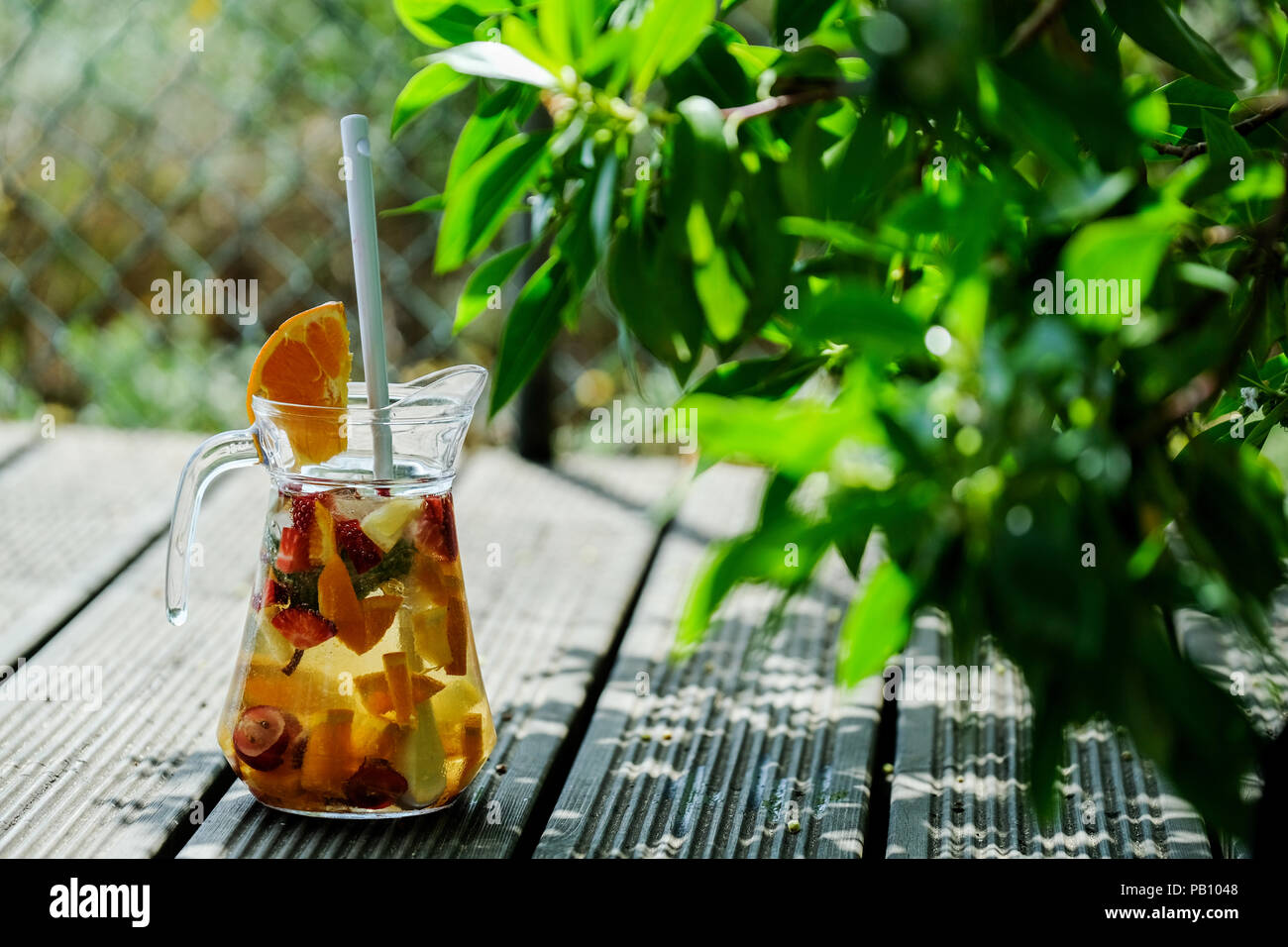 Cold Fruit Punch served in glass can with many fruits Stock Photo - Alamy