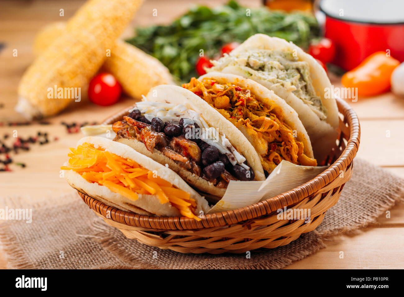 Combination of the typical South American Arepas in a woven basket ...