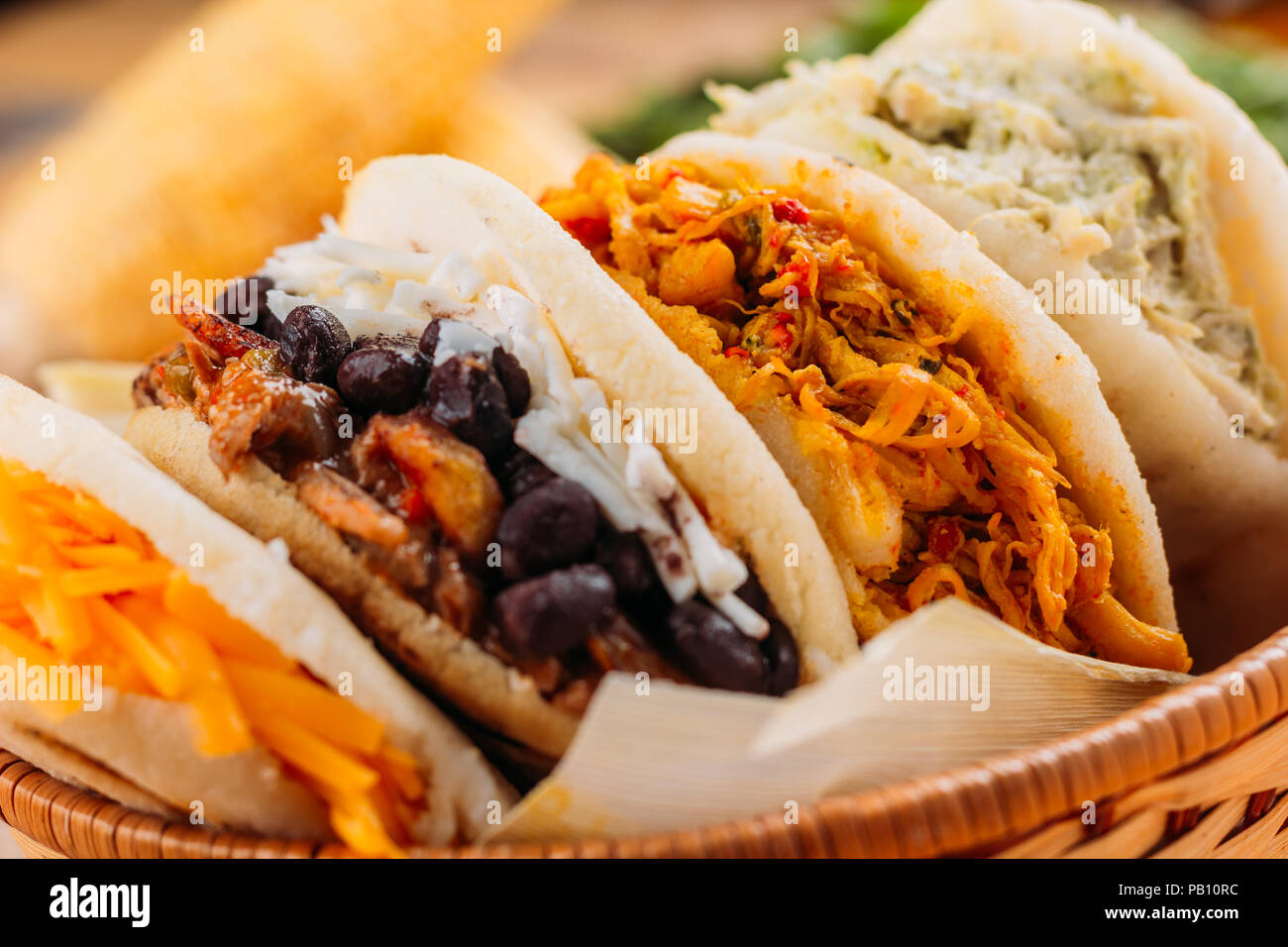 Combination of the typical South American Arepas in a woven basket ...