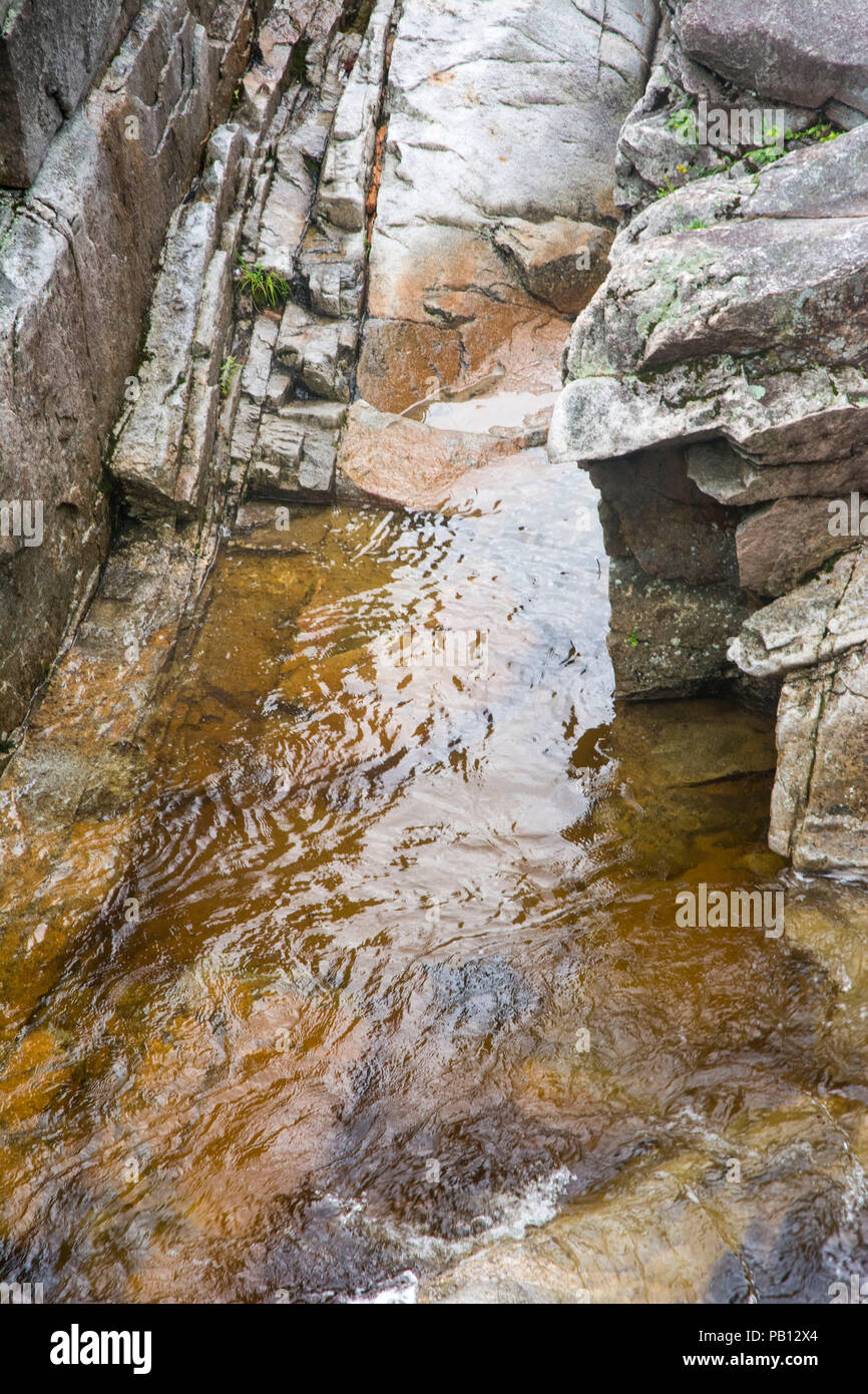 Sharp rocks show of the danger of wet slippery environments Stock Photo ...