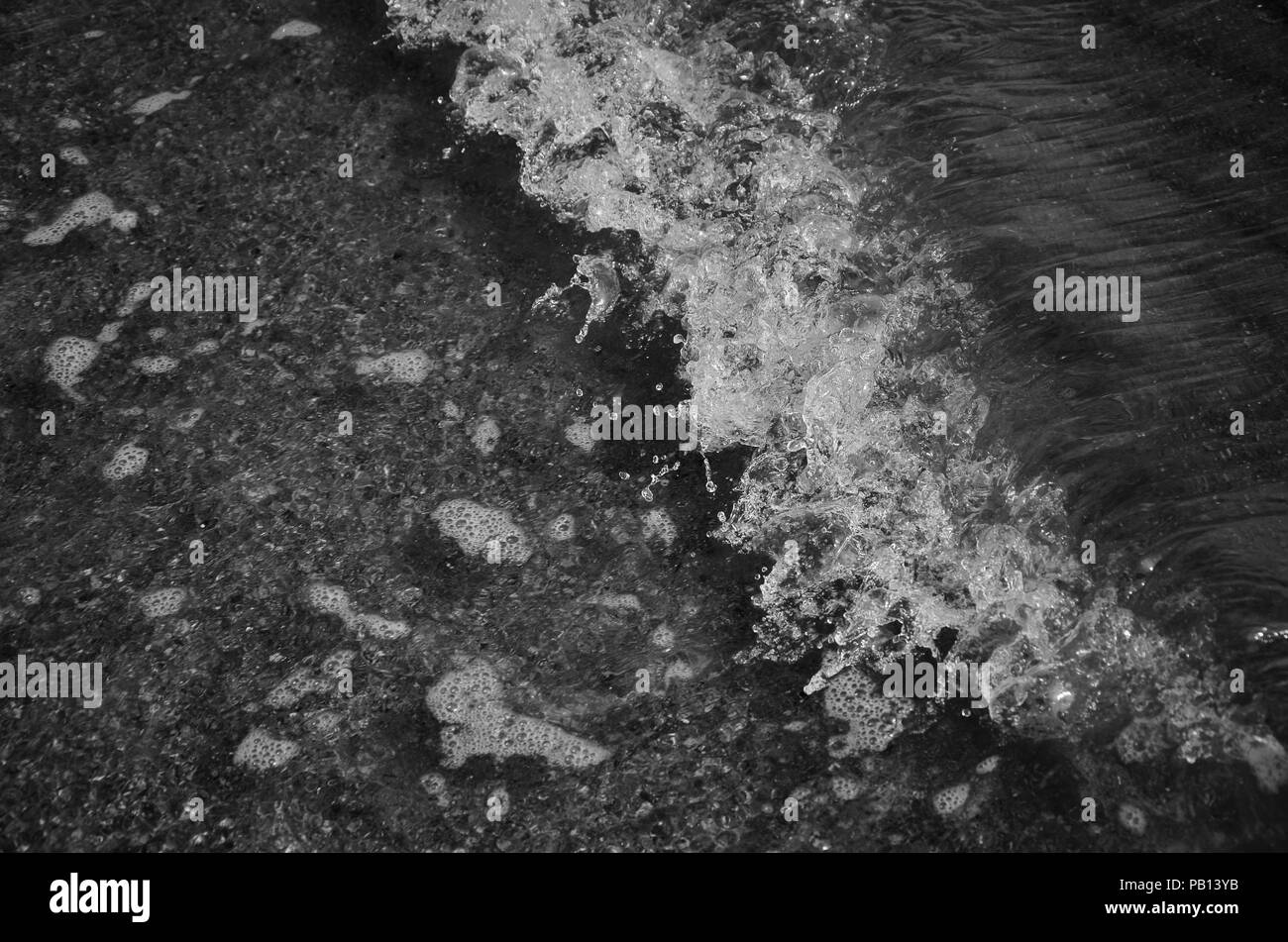 Sea water lapping shoreline Black and White Stock Photos & Images - Alamy