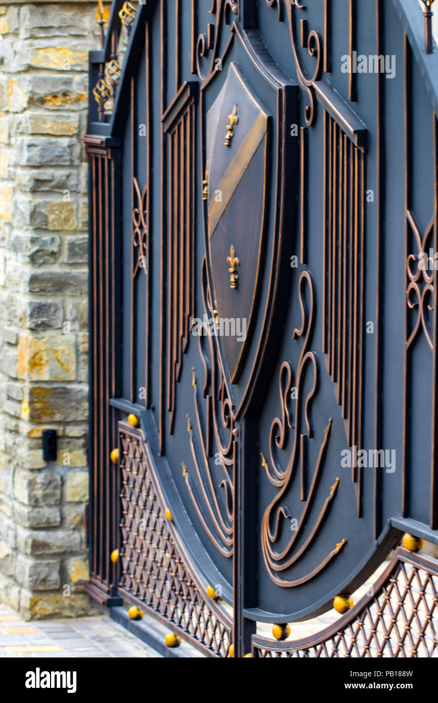 ornate wrought-iron elements of metal gate decoration Stock Photo - Alamy