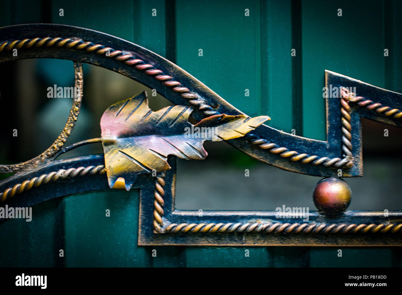 ornate wrought-iron elements of metal gate decoration Stock Photo - Alamy