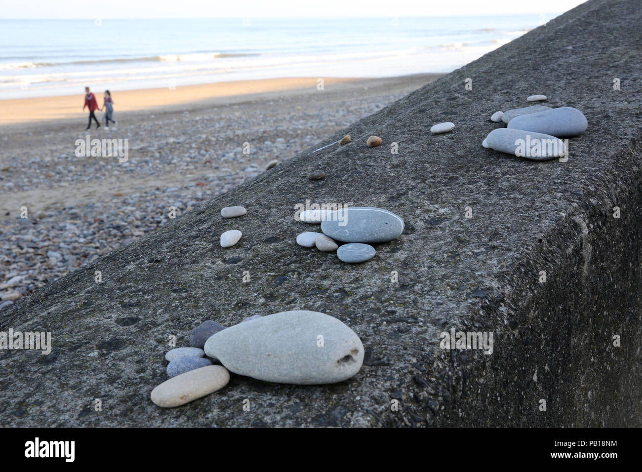 Two People Strolling along Beach, North East Coast, UK Stock Photo - Alamy