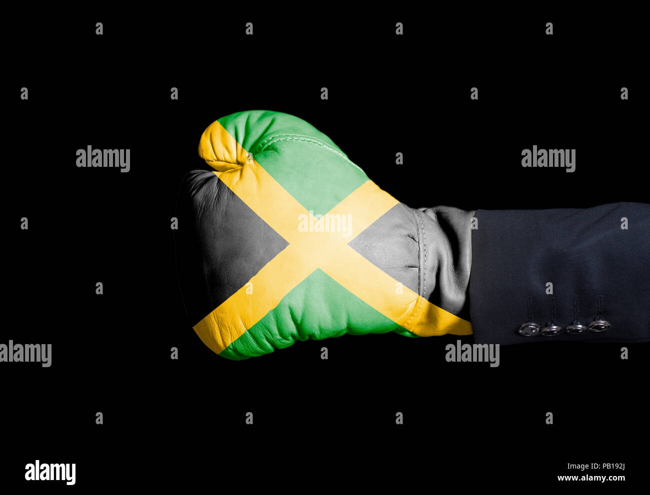 Male hand in Boxing glove with Jamaica flag isolated on black ...