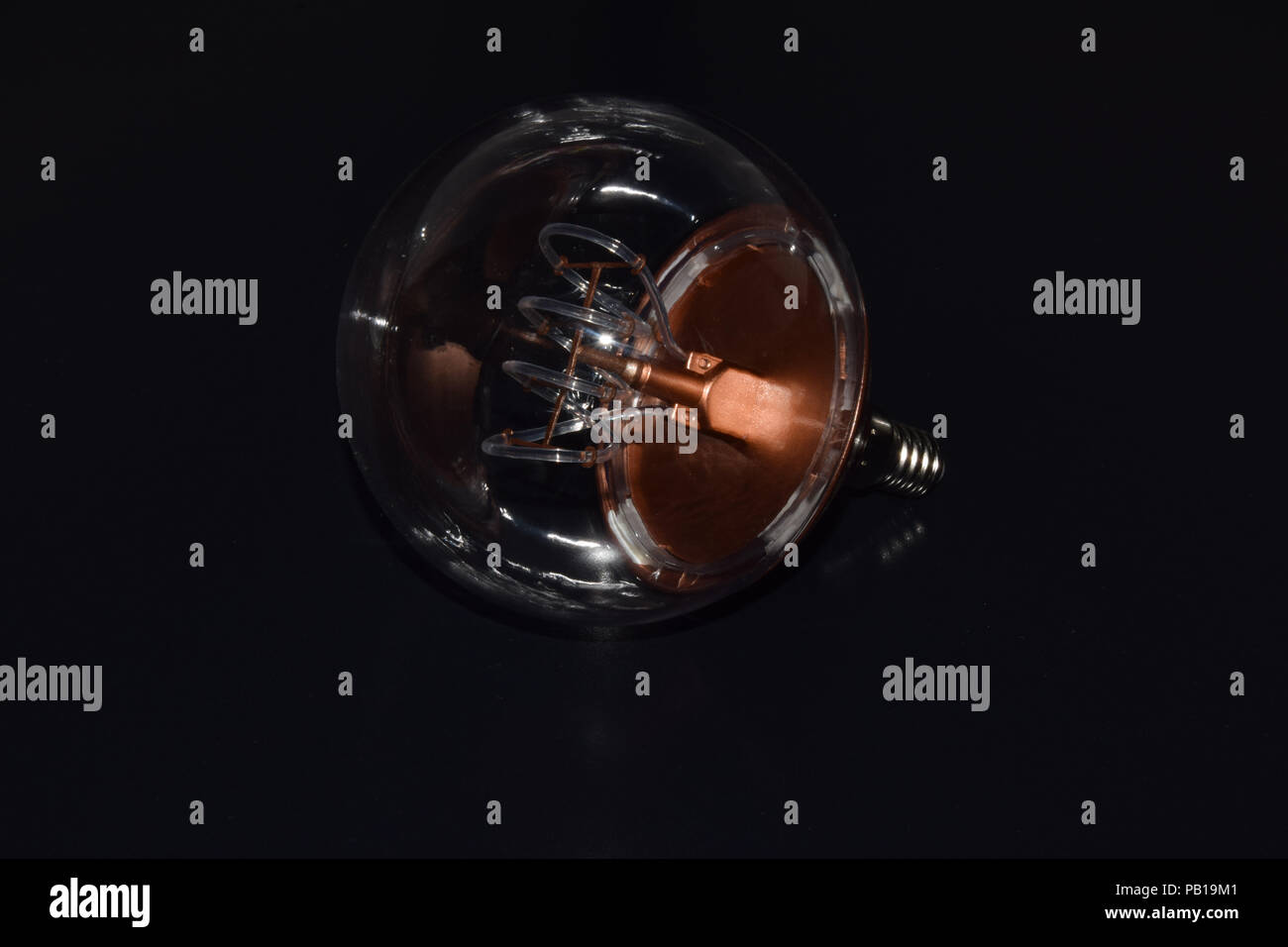 Detailed Light Bulb on Black Background Stock Photo - Alamy
