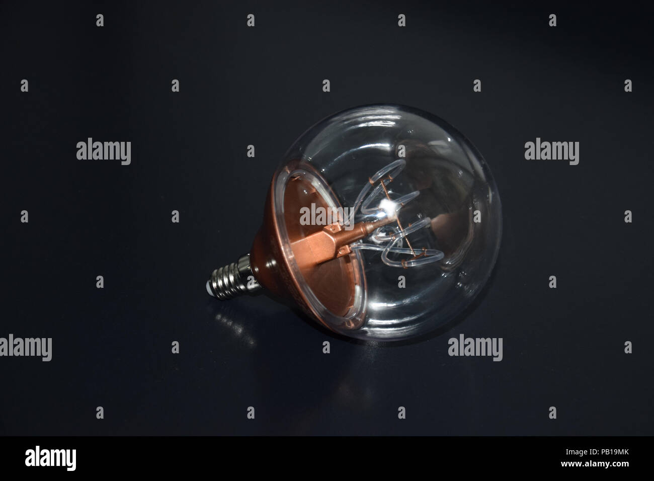 Detailed Light Bulb on Black Background Stock Photo - Alamy