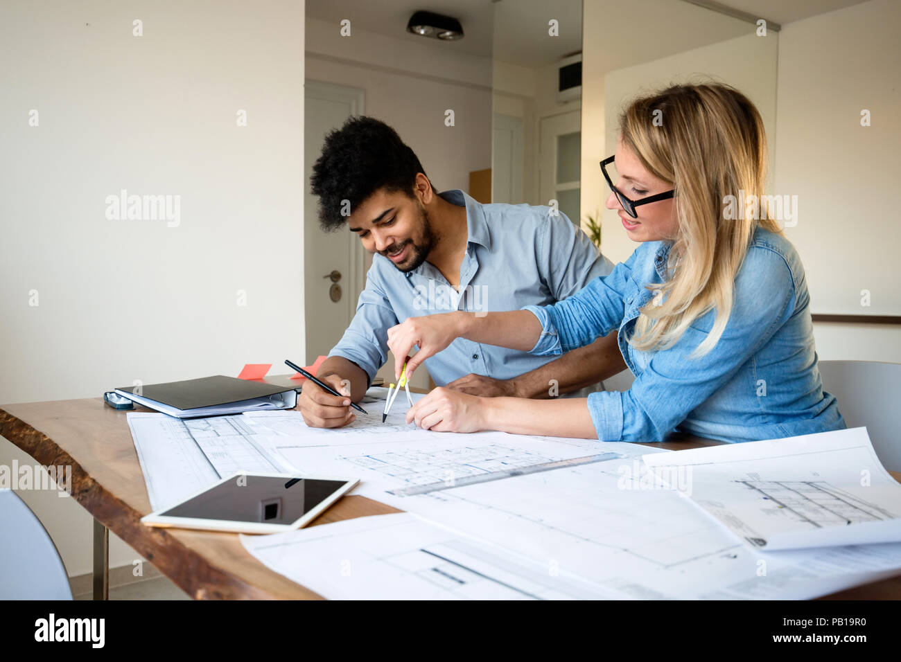 Business People and architects working on project together Stock Photo ...