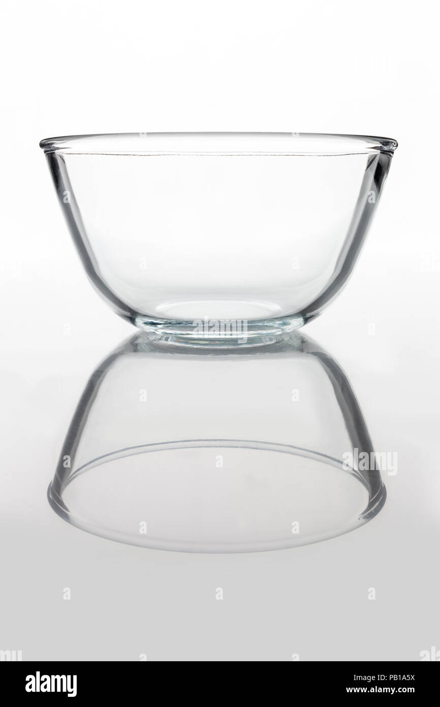 Glass transparent bowl on white background from side with reflection ...