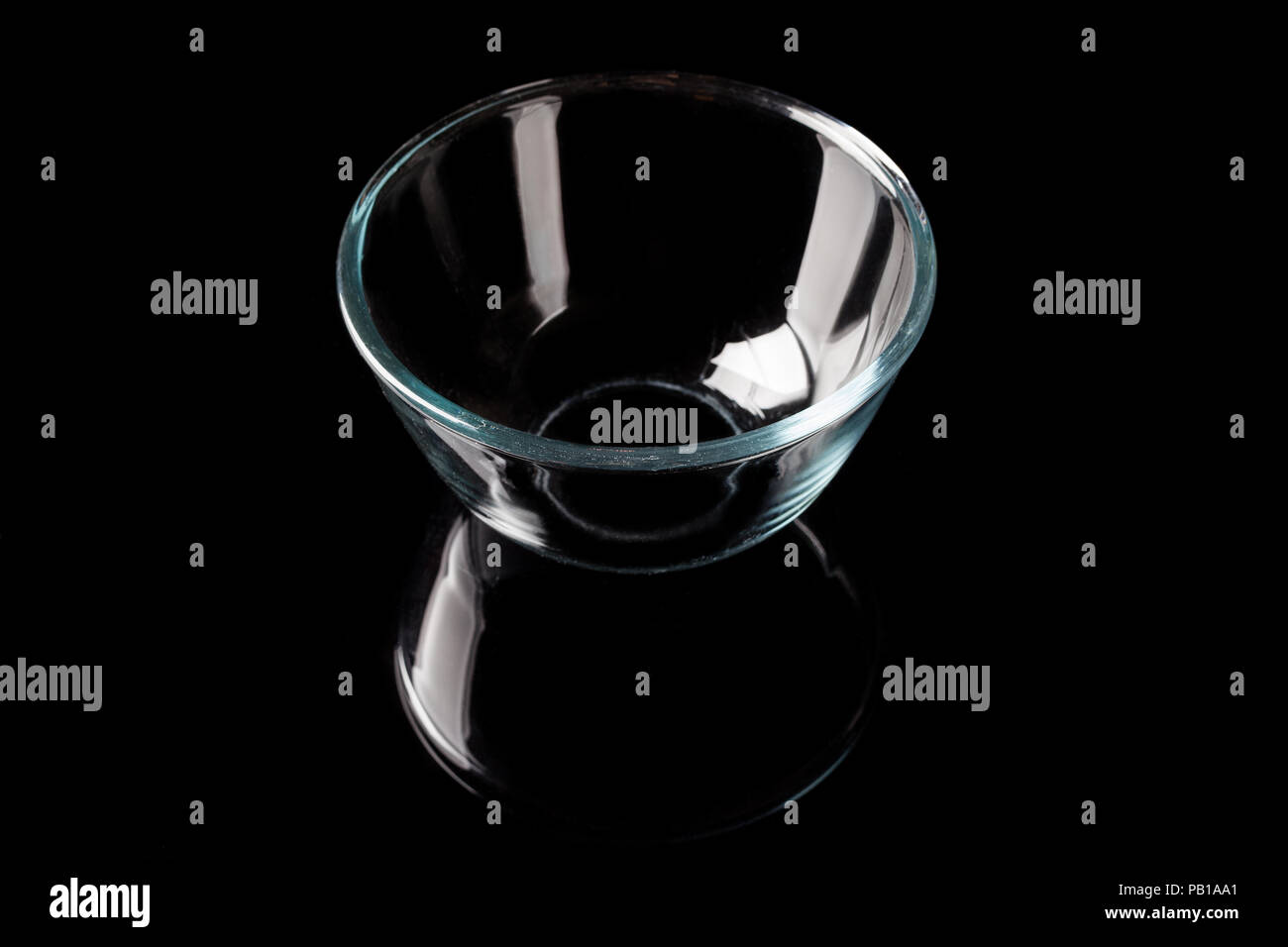 Glass transparent bowl on black background from high angle with ...