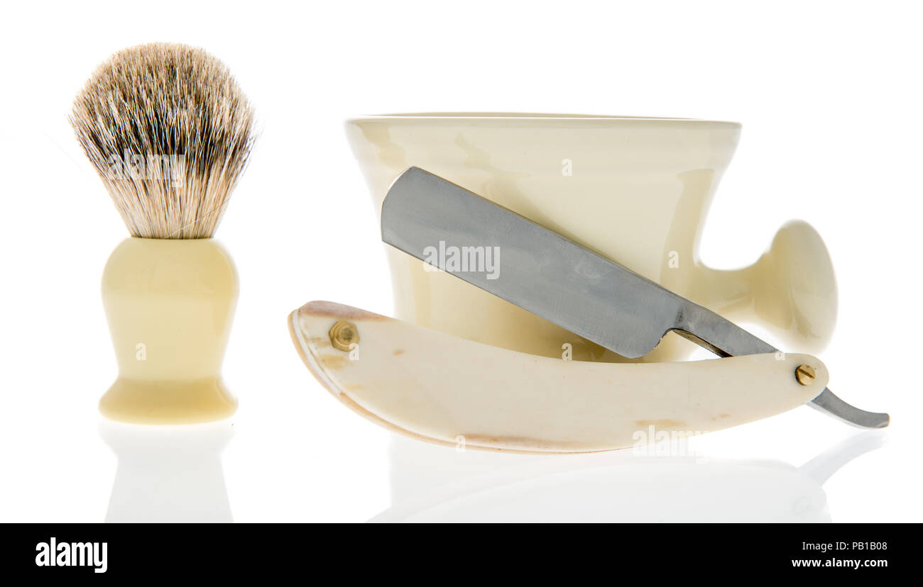 A straight razor set made out of ivory on an isolated background Stock ...