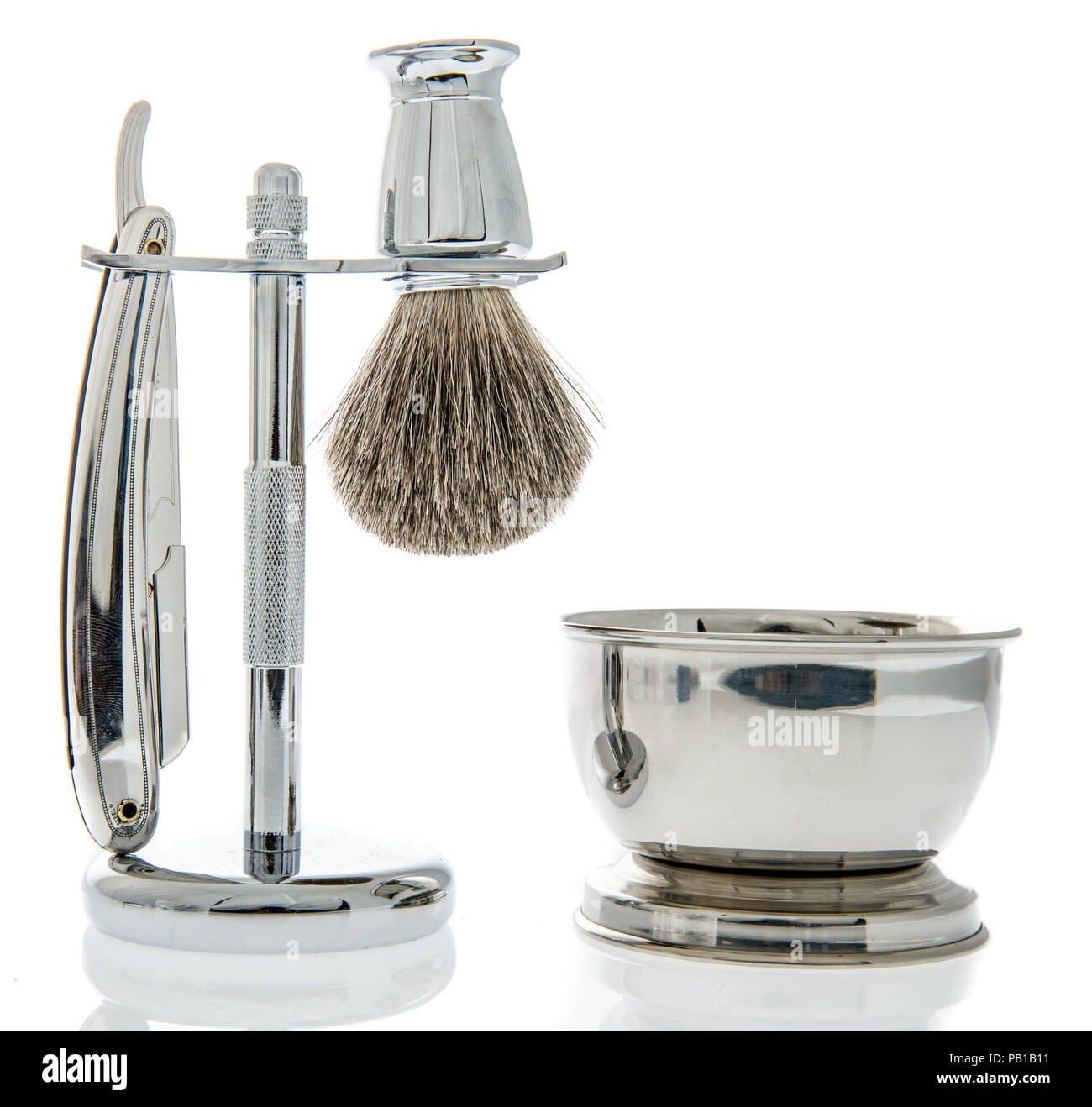 A straight razor set made out of stainless steel on an isolated ...