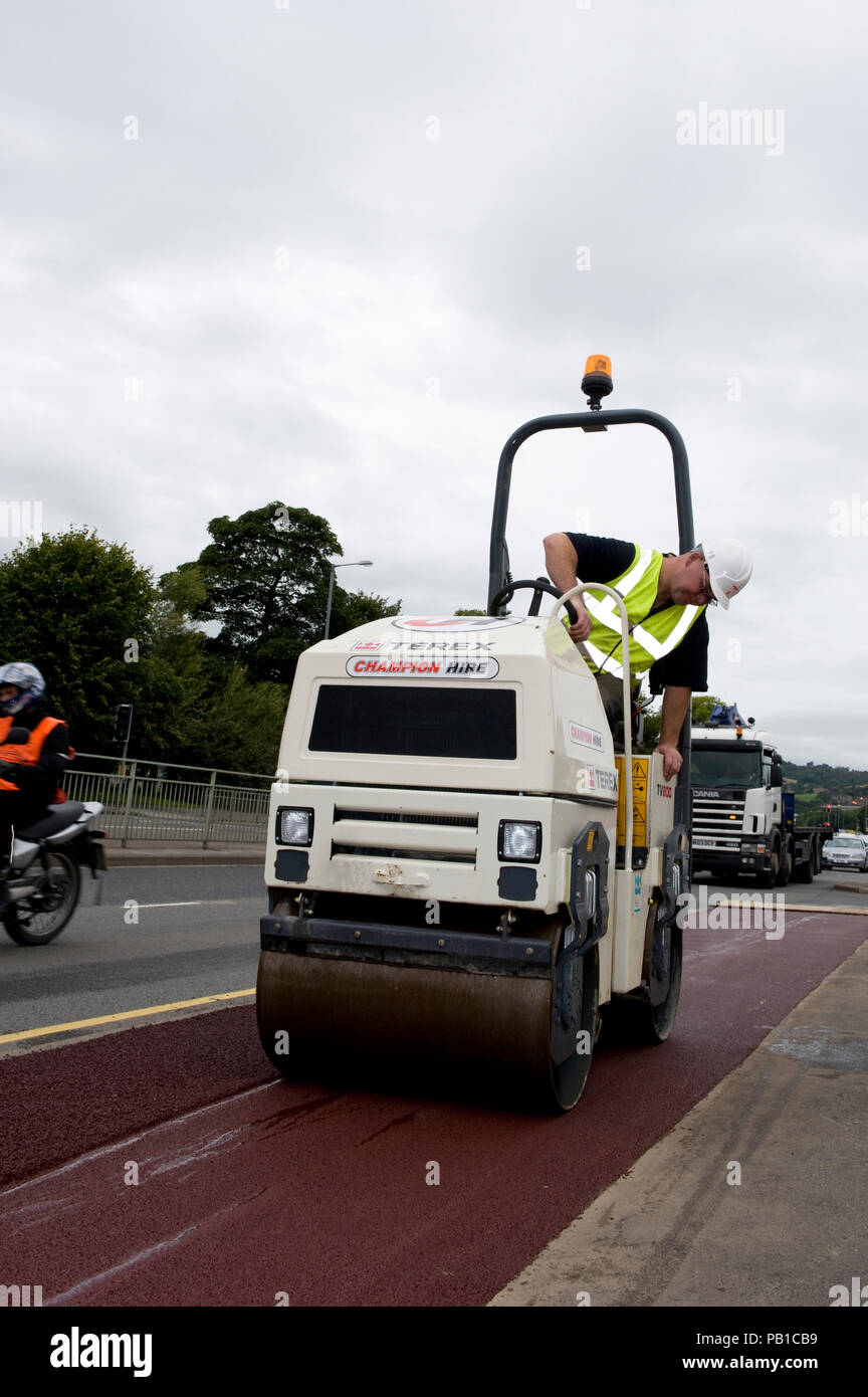 Laying red asphalt in the UK Stock Photo - Alamy