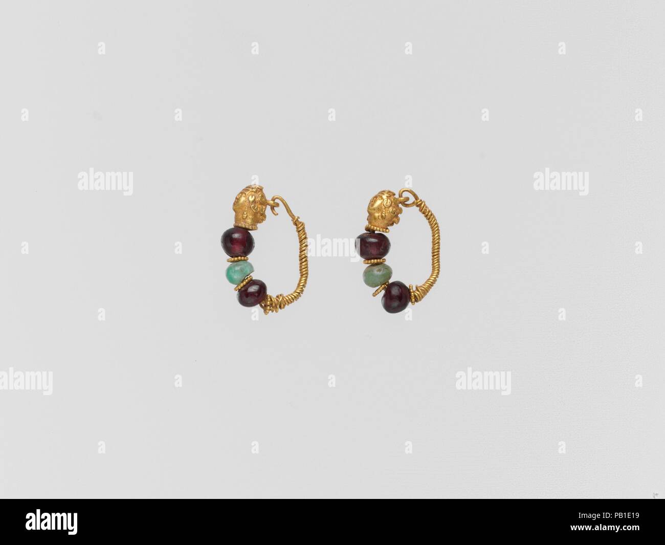 Gold earring with woman's head and beryl and garnet beads. Culture ...