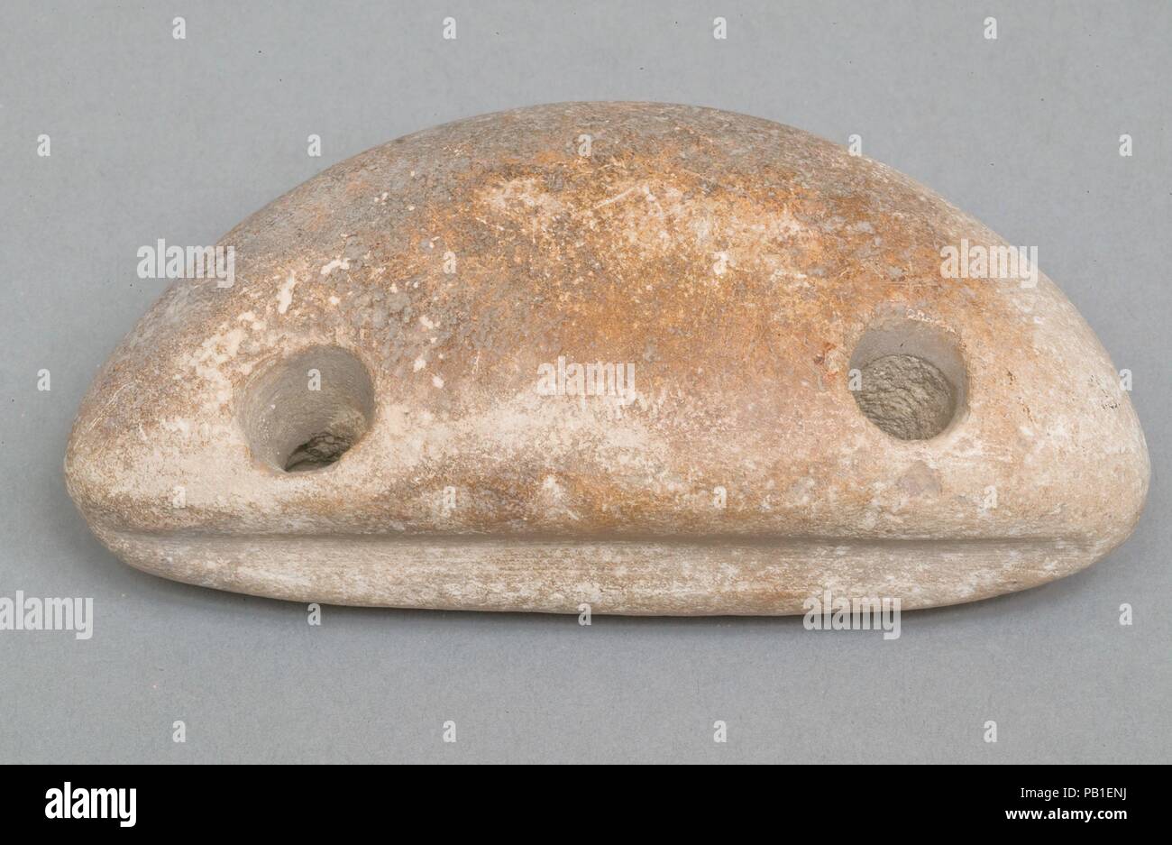 Weighing down device (fish net sinker?). Dimensions: l. 10.9 cm (4 5/16 ...