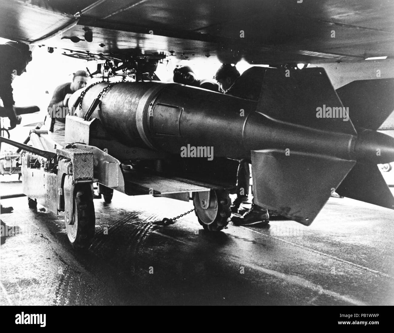 A-1 Skyraider of VA-95 is armed on USS Ranger (CVA-65) in March 1965 ...