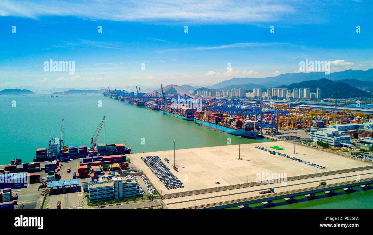Aerial view of Busan new port of South Korea. Container ship in import ...