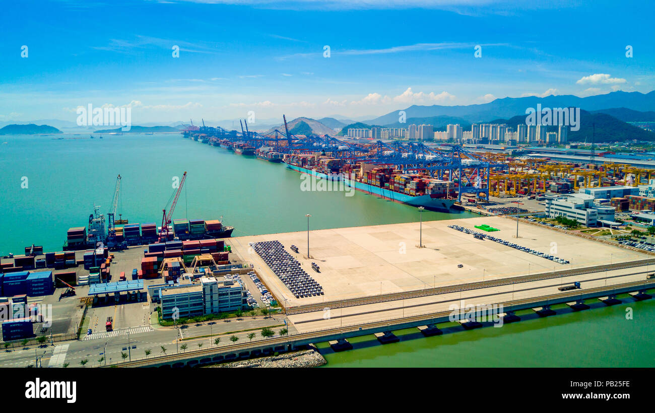 Aerial view of Busan new port of South Korea. Container ship in import ...