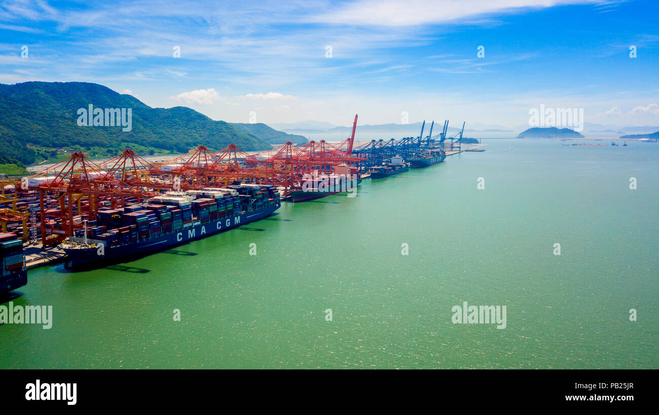 Aerial view of Busan new port of South Korea. Container ship in import ...